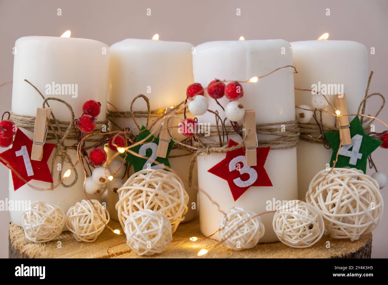 Four Advent candles calendar with Christmas zero waste decorations. Holiday preparation copy ...