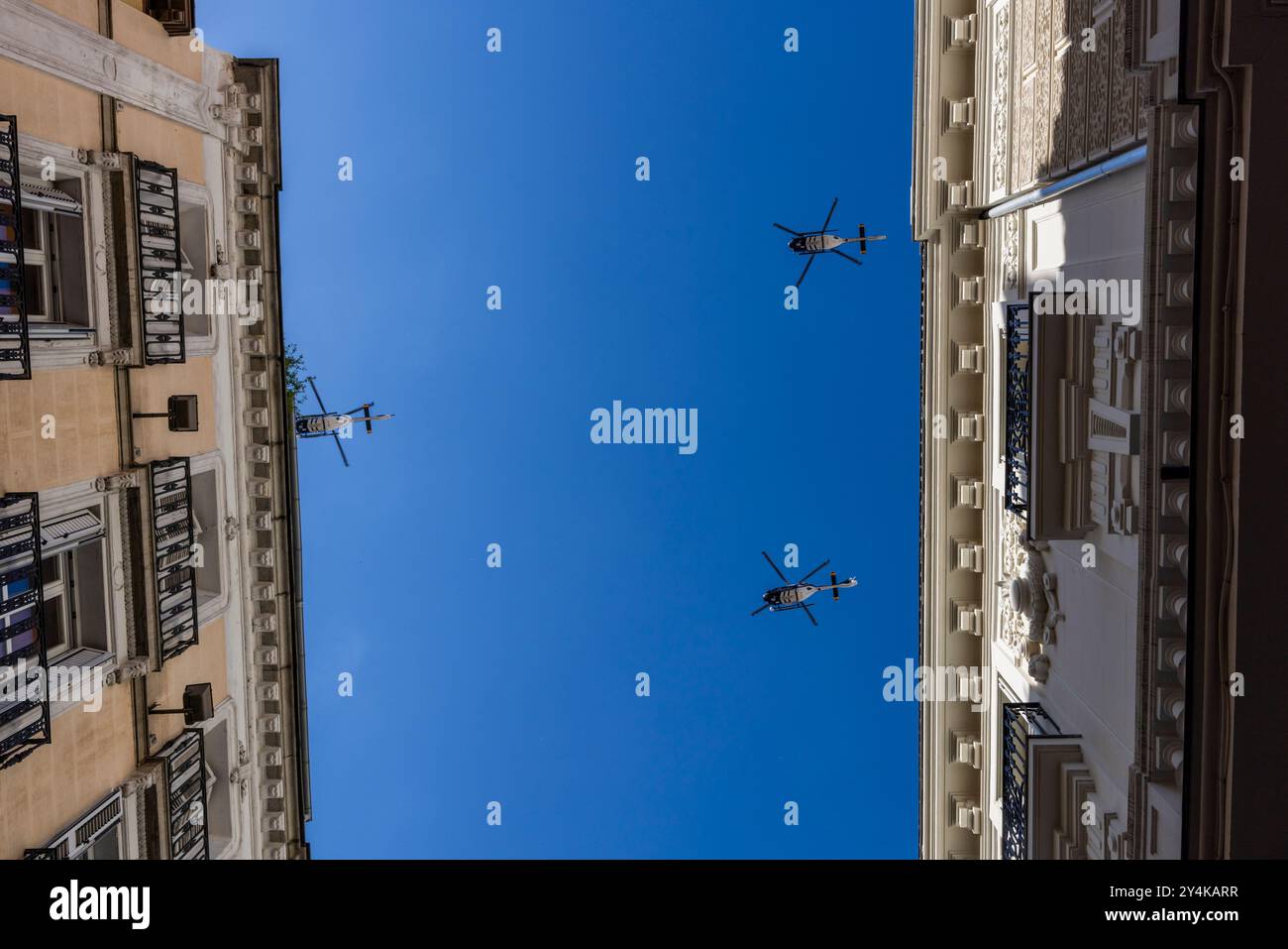 Three helicopters in the sky over Madrid, Spain Stock Photo - Alamy