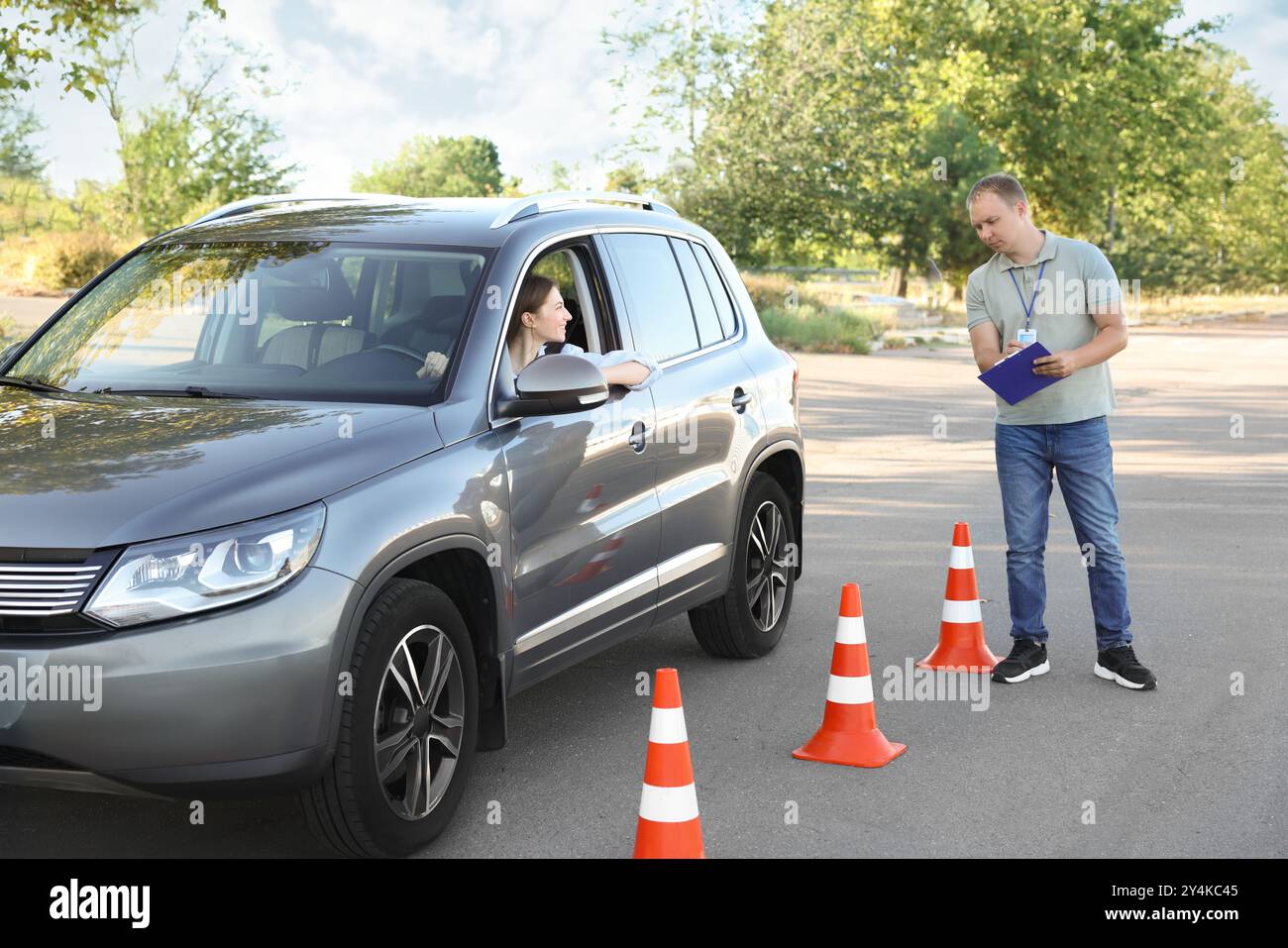 Woman passing maneuverability driving test on track Stock Photo - Alamy