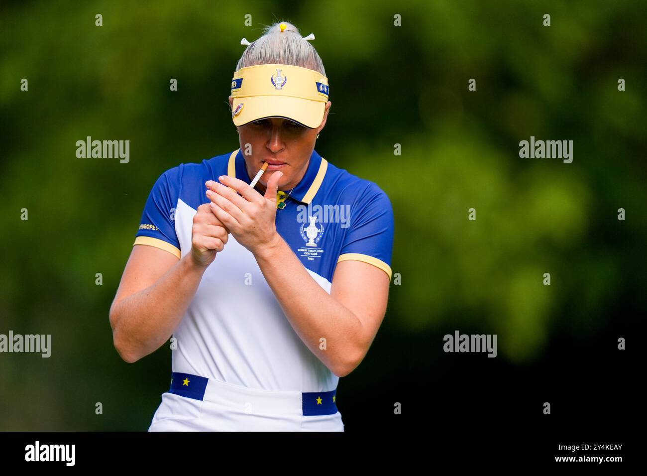 Europe's Charley Hull lights up a cigarette after hitting from the ...