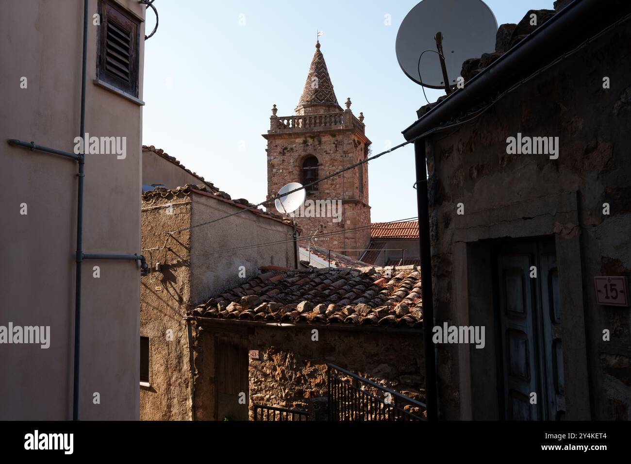 Rustic village rooftops with historic bell tower in Mediterranean ...