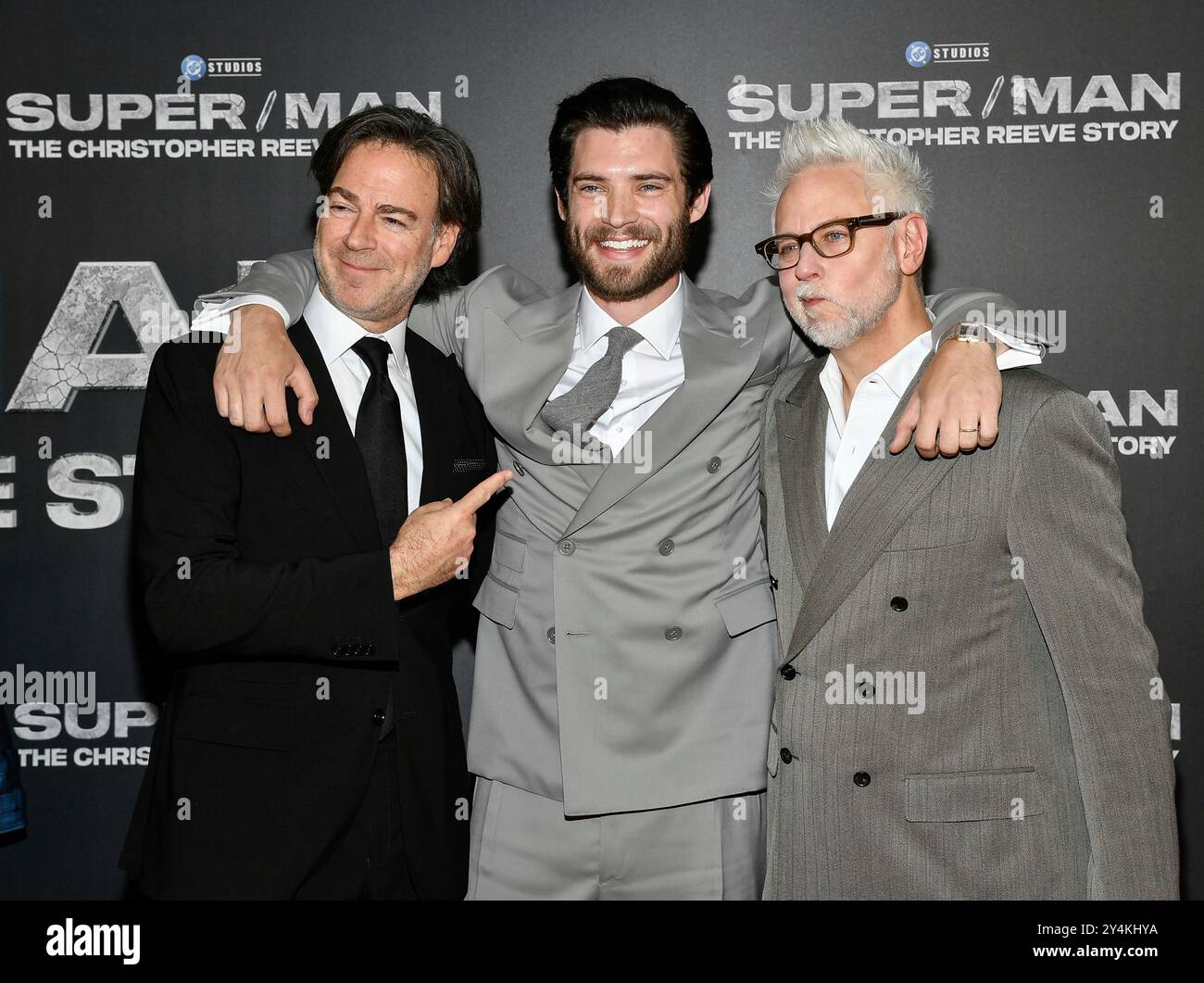 Peter Safran, left, David Corenswet and James Gunn attend the premiere ...