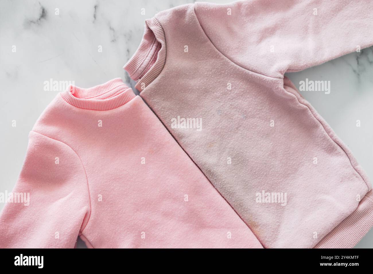 new vs old and used clothes, identical sweaters side by side one being ...