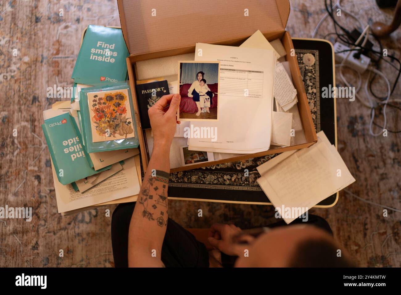 Robert Calabretta holds a picture of his biological mother and brother ...