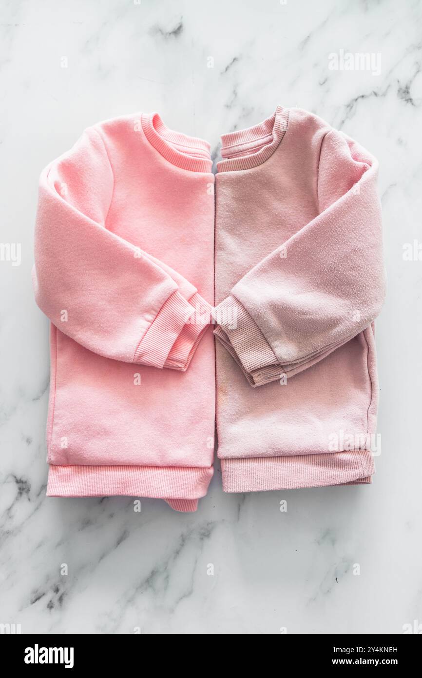 new vs old and used clothes, identical sweaters side by side one being ...