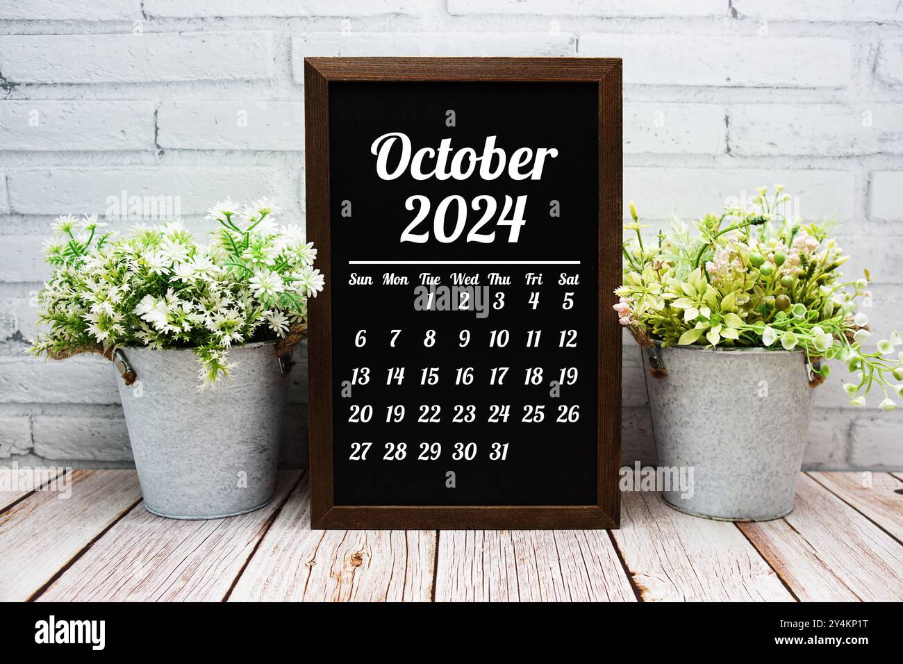 October 2024 monthly calendar on chalkboard for planning and management ...