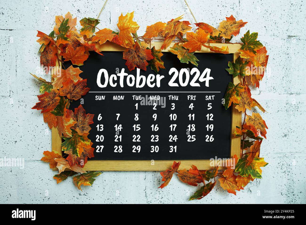 October 2024 monthly calendar with maple leaf decoration Stock Photo ...