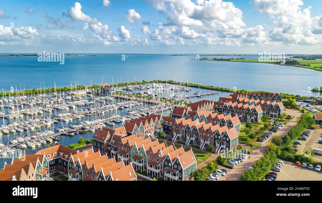 Aerial drone view of typical modern Dutch houses and marina in harbor ...