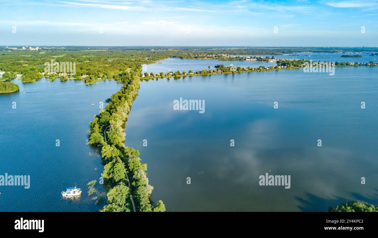 Aerial drone view of path on dam in polder water from above, landscape ...