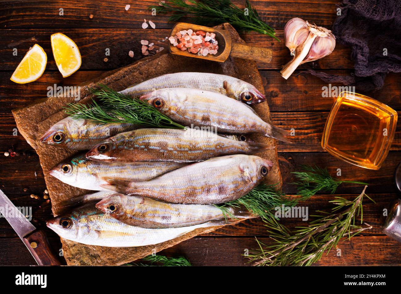 Sea delicacies. Fresh seafood. Fish Grouper on stone board Stock Photo ...