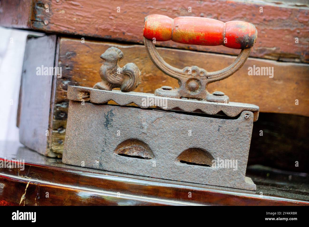 An old-style iron that uses charcoal as a heating material Stock Photo ...