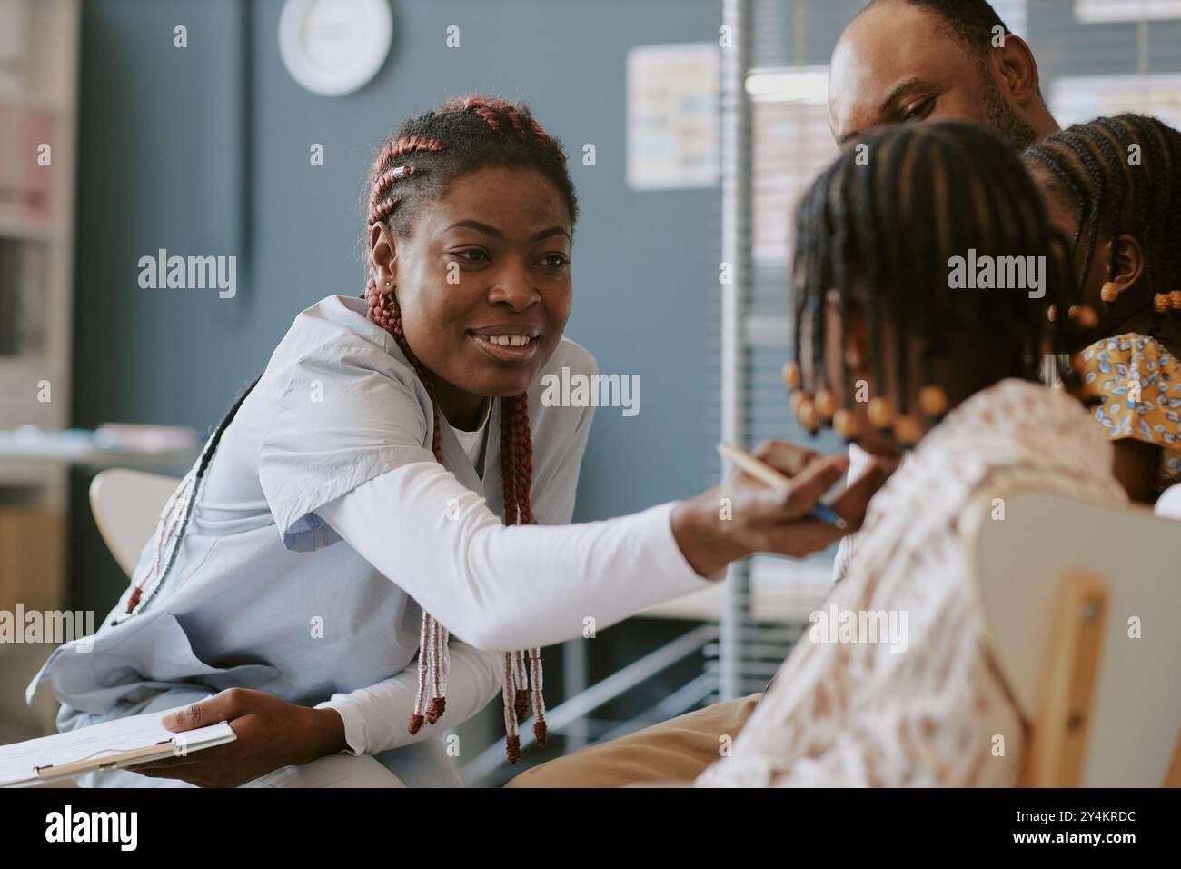 Healthcare Professional Providing Pediatric Consultation Stock Photo ...