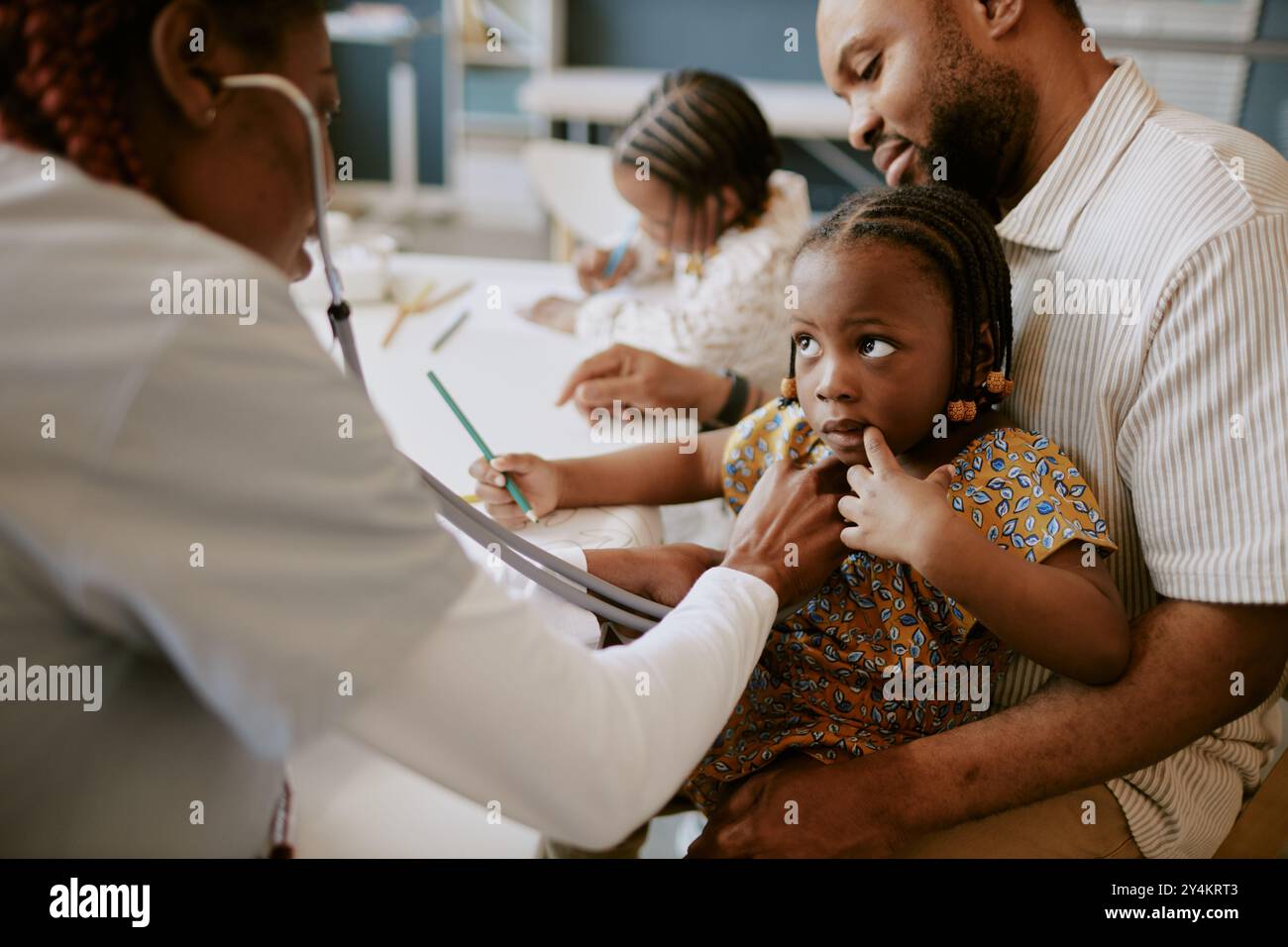 Pediatrician doctor examining child hi-res stock photography and images ...