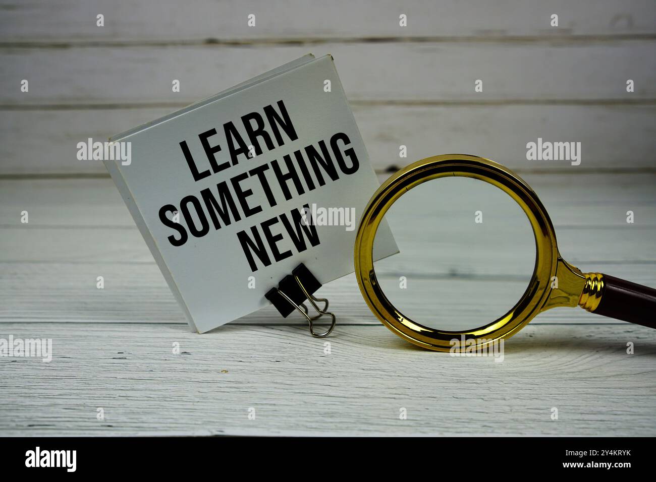 Learn Something New text message on sticky note with magnifying glass ...