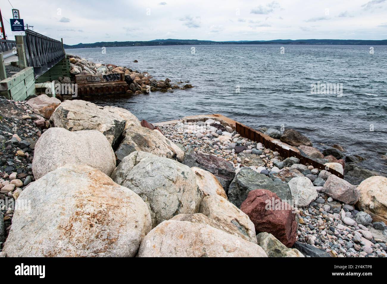 Concrete and steel support remains from the defunct railway bridge in ...