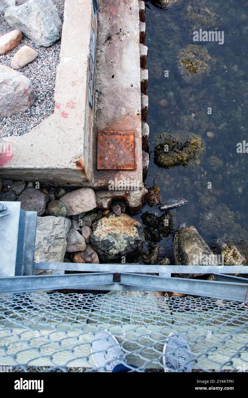 Concrete and steel support remains from the defunct railway bridge in ...
