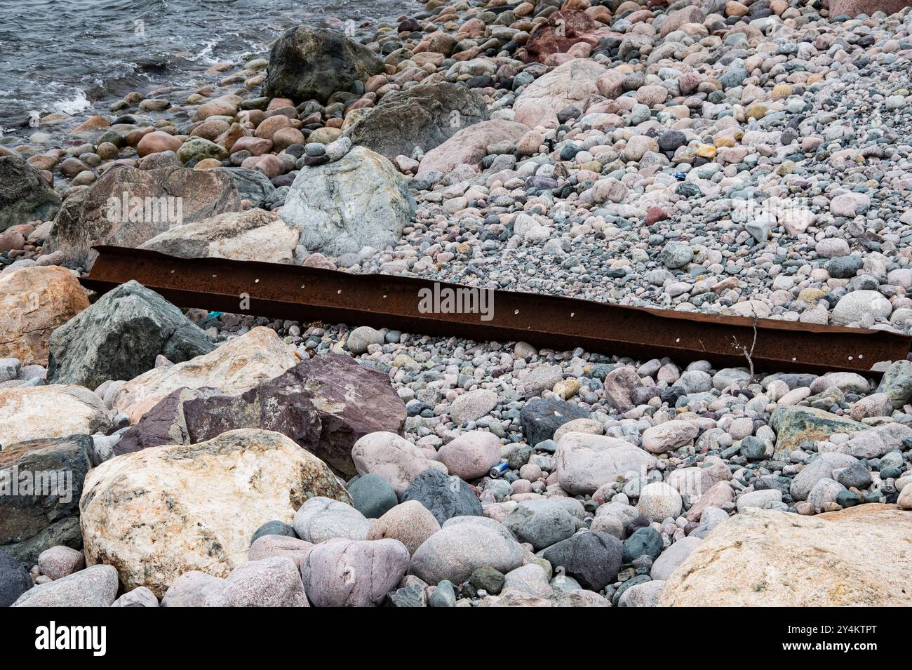 Concrete and steel support remains from the defunct railway bridge in ...