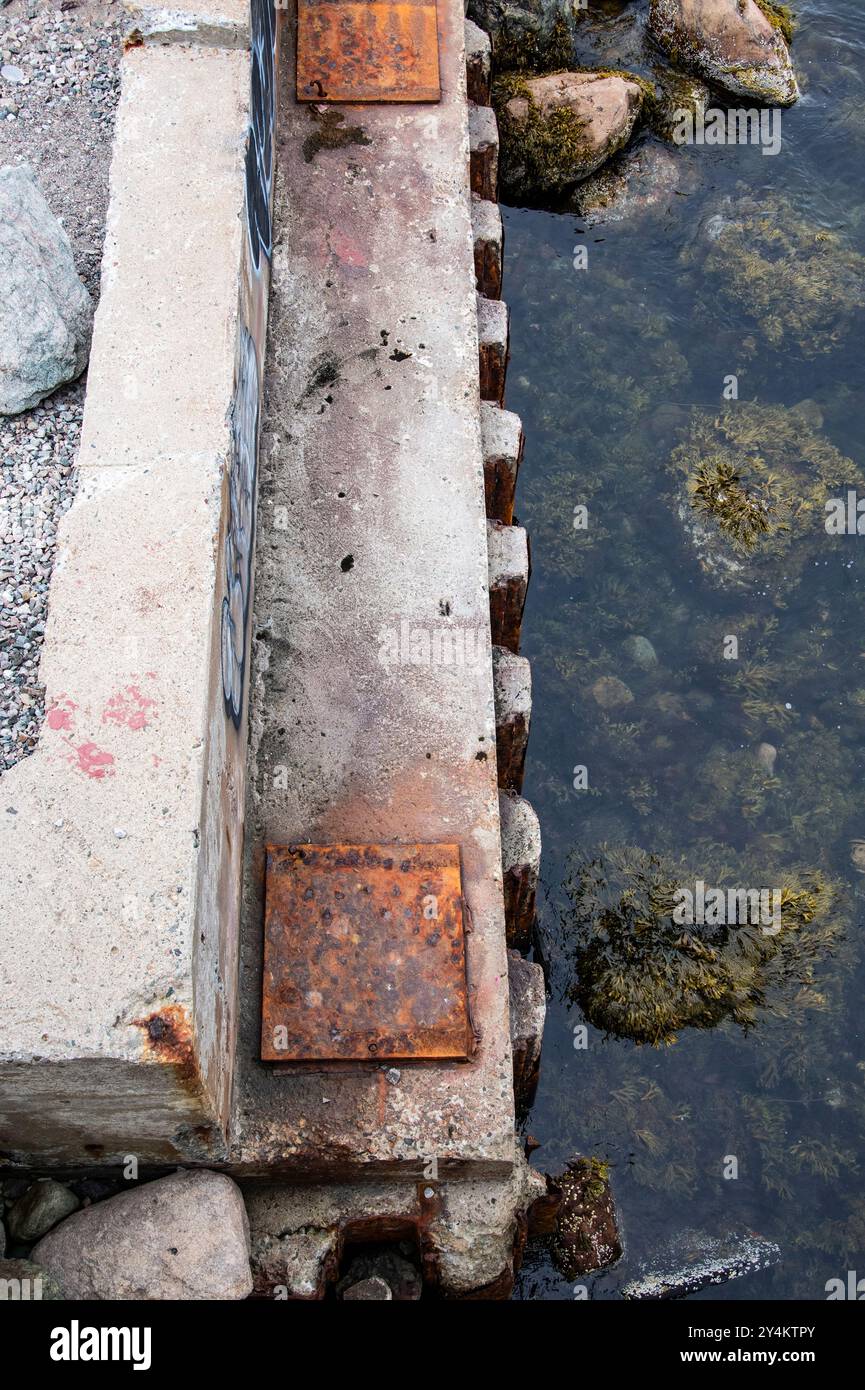 Concrete and steel support remains from the defunct railway bridge in ...