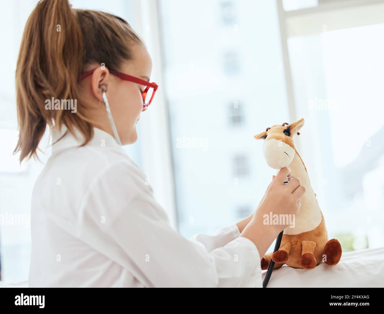 Pretend, stethoscope and child doctor with teddy bear in home for ...