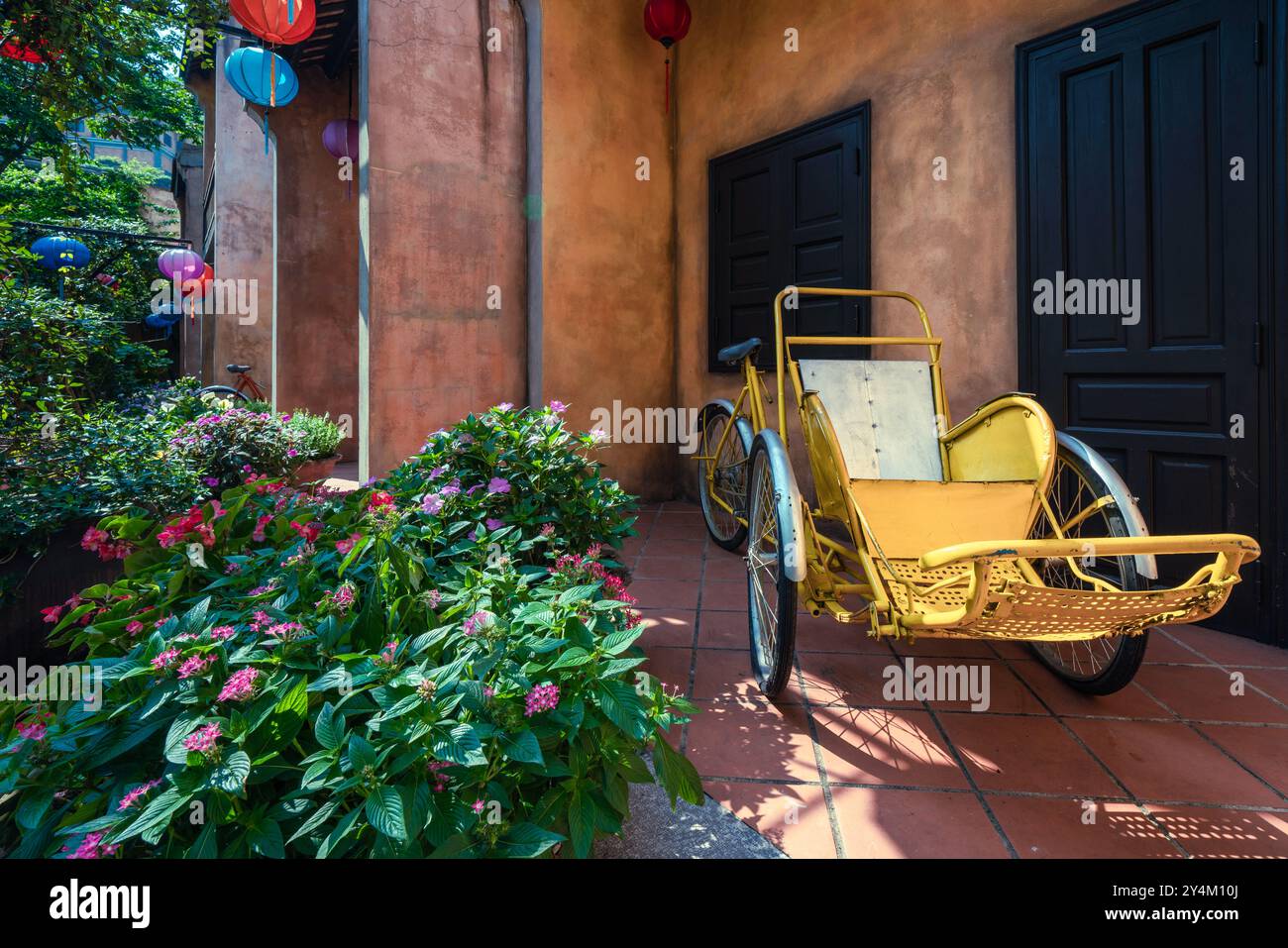 This is a traditional Vietnamese rickshaw outside some old style model ...