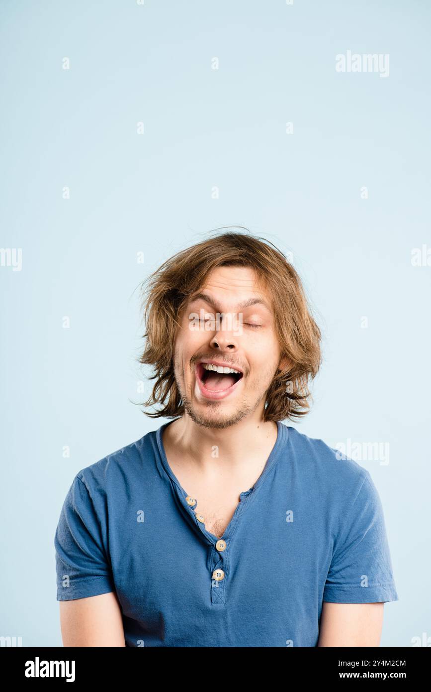 Funny, face and man in studio space with smile, comedy and happy ...