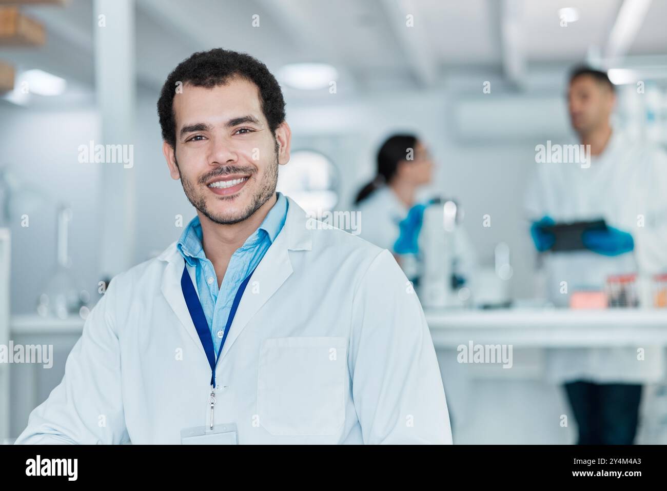 Man, portrait and smile in lab for science, chemical engineering and ...