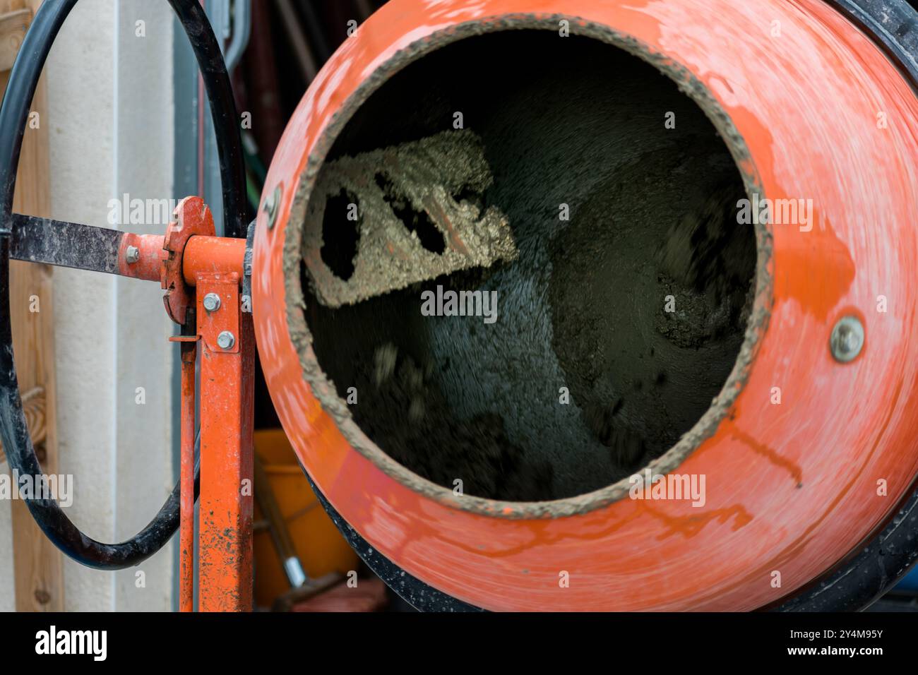 Concrete mixer mixing cement, sand and water to produce concrete Stock ...