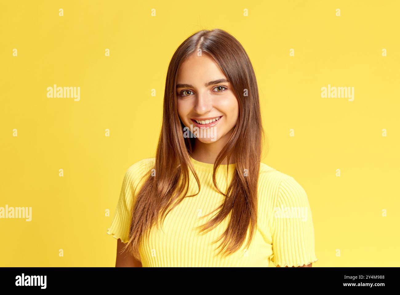 Young beautiful girl, student looking with bright smile at camera ...
