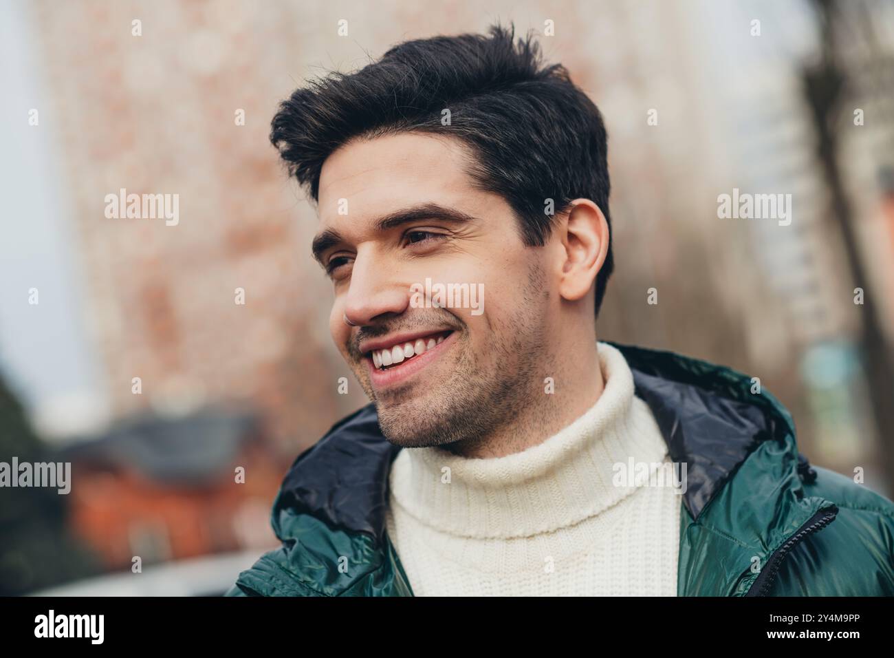 Photo of cheerful smiling handsome man walking exploring city street in ...