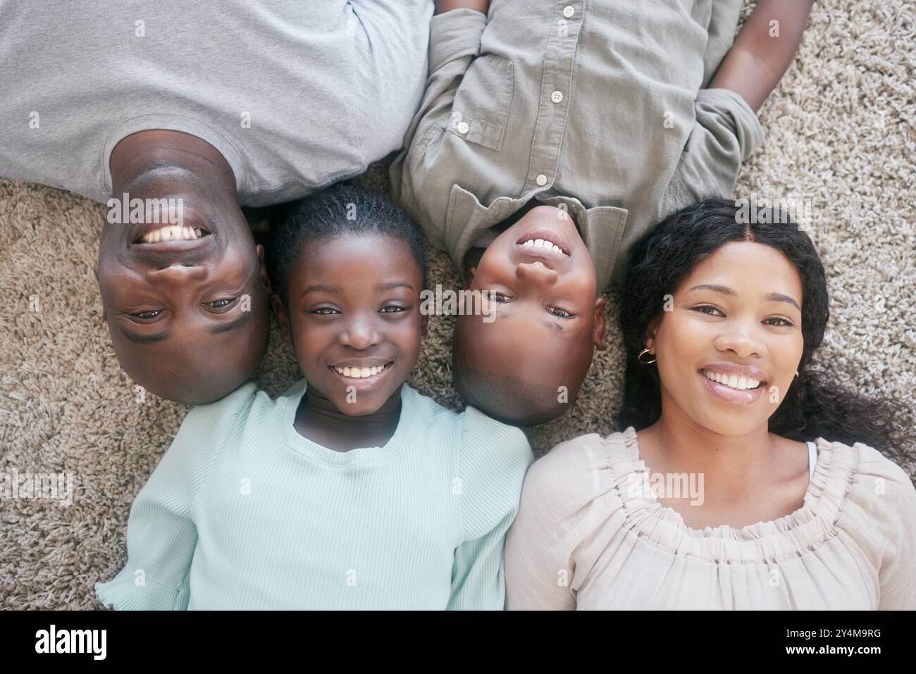 Black family, happy and portrait on floor in home with support, bonding ...