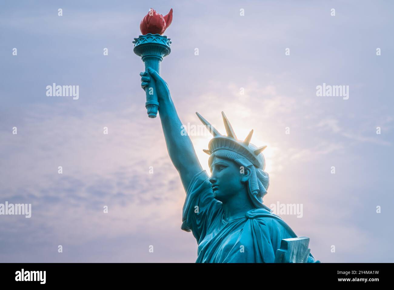 A replica of the Statue of Liberty stands as a beacon of hope against a ...