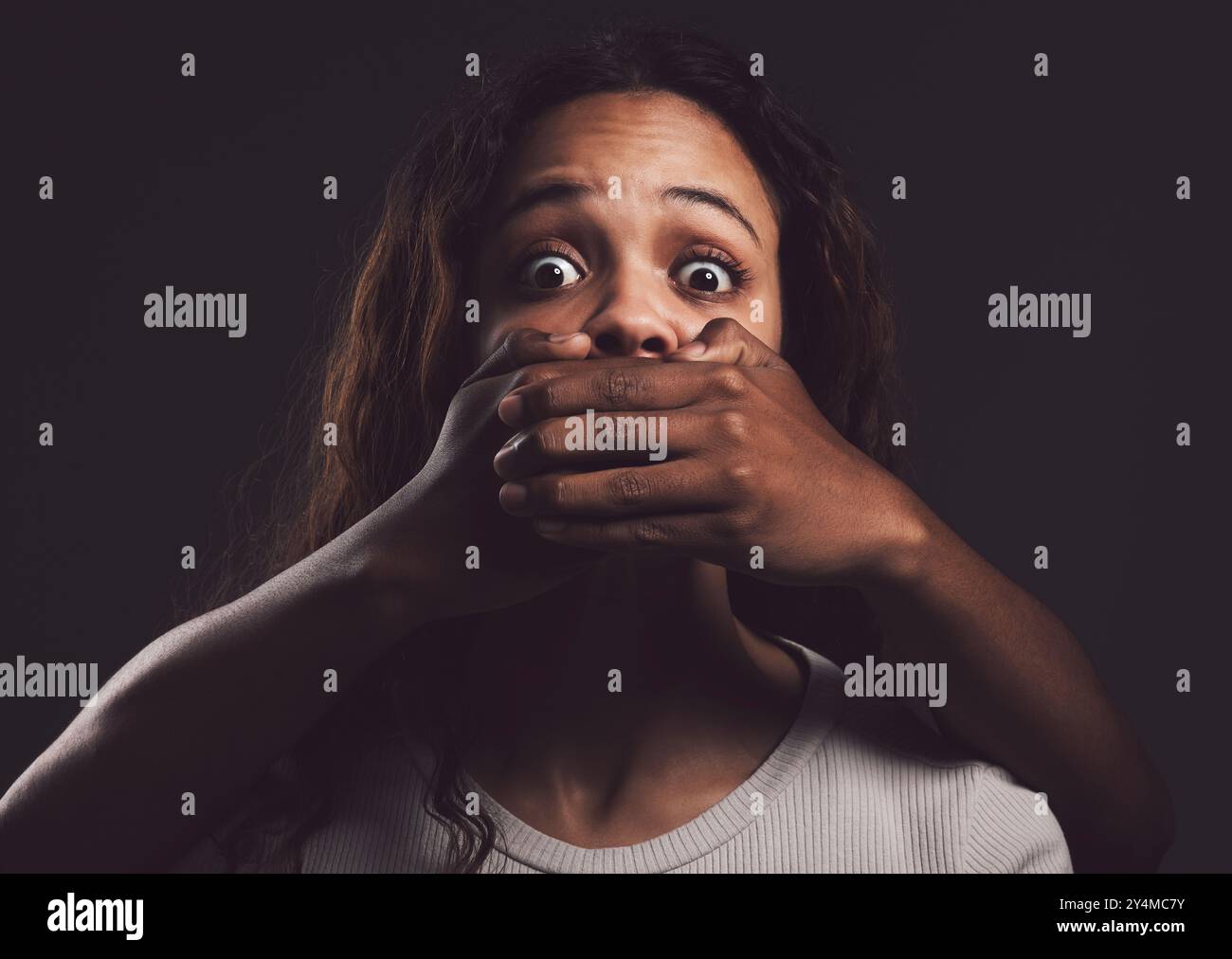 Portrait, hands and covering mouth in abuse, anxiety or fear for mental ...