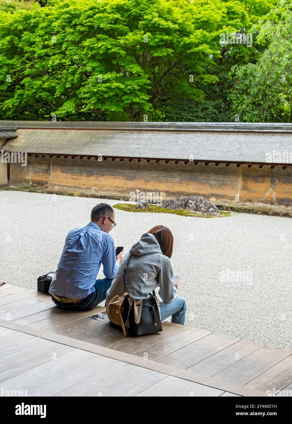 Visitors at Kare-sansui - dry landscape Zen temple garden, Ryoan-ji ...