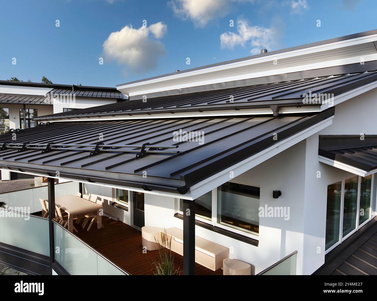 Close-up house retro roof panel with standing seam and fasteners ...