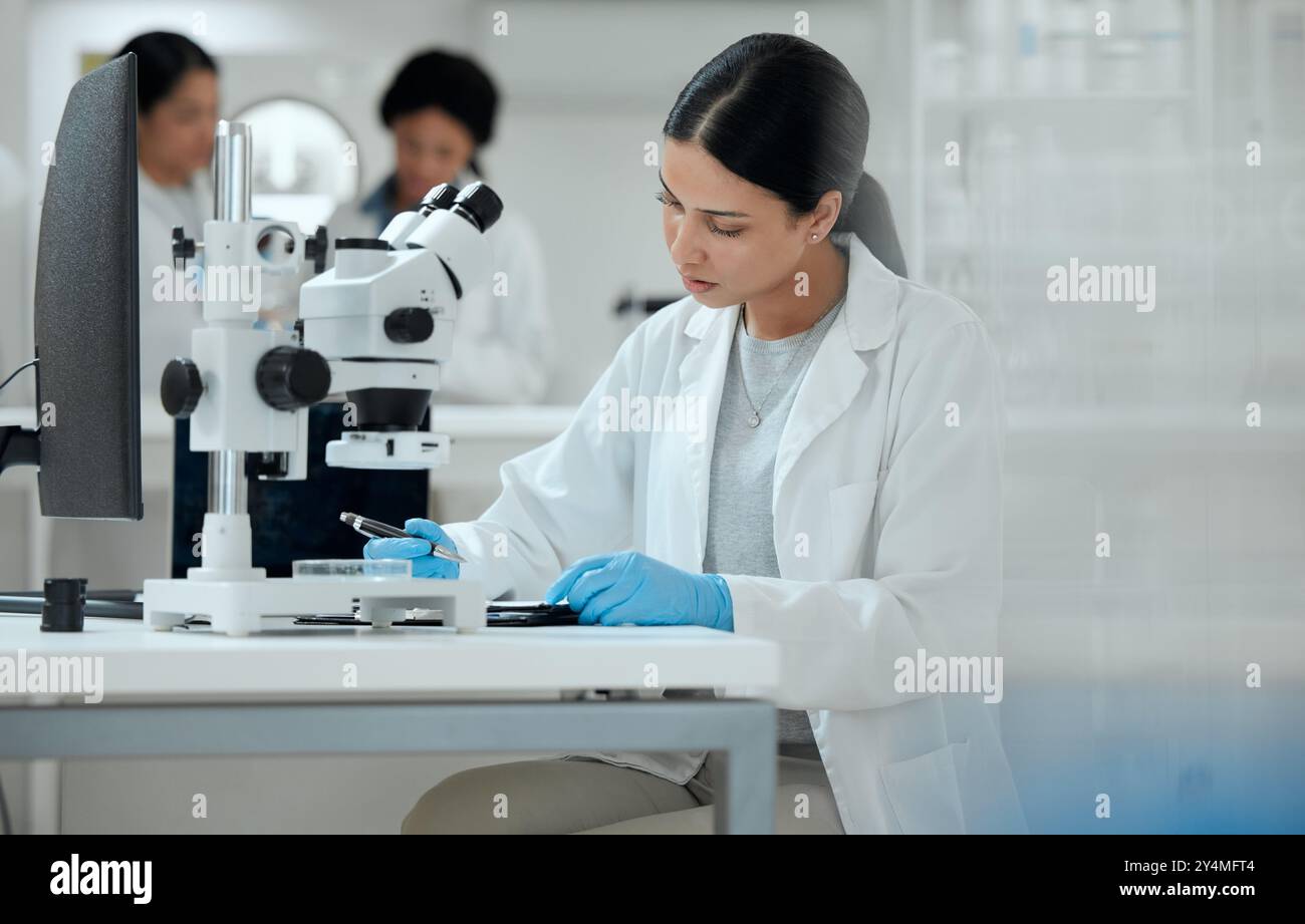 Scientist, study and woman with microscope in lab for medical ...