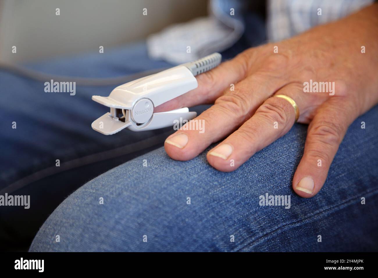 Close up of a Pulse Oximeter on Patients Finger used to Measure Your ...