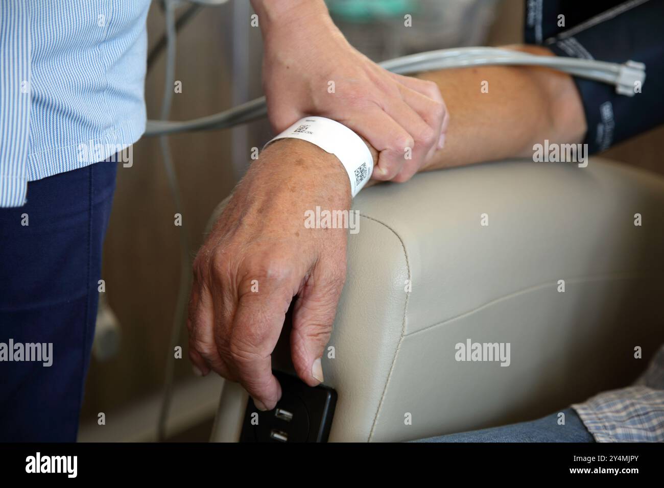 Nurse Taking Patient's Pulse from Wrist Surrey England Stock Photo - Alamy