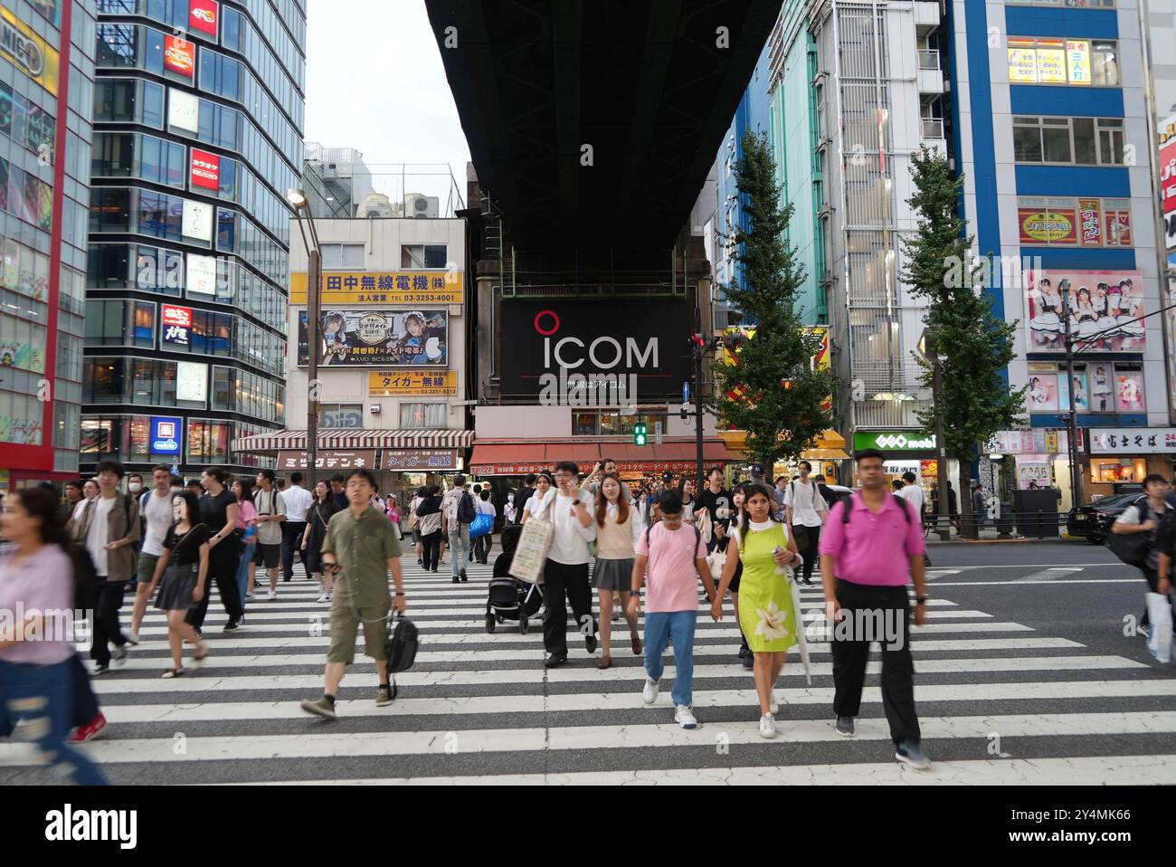 A billboard shows a logo of Japanese wireless communication equipment ...