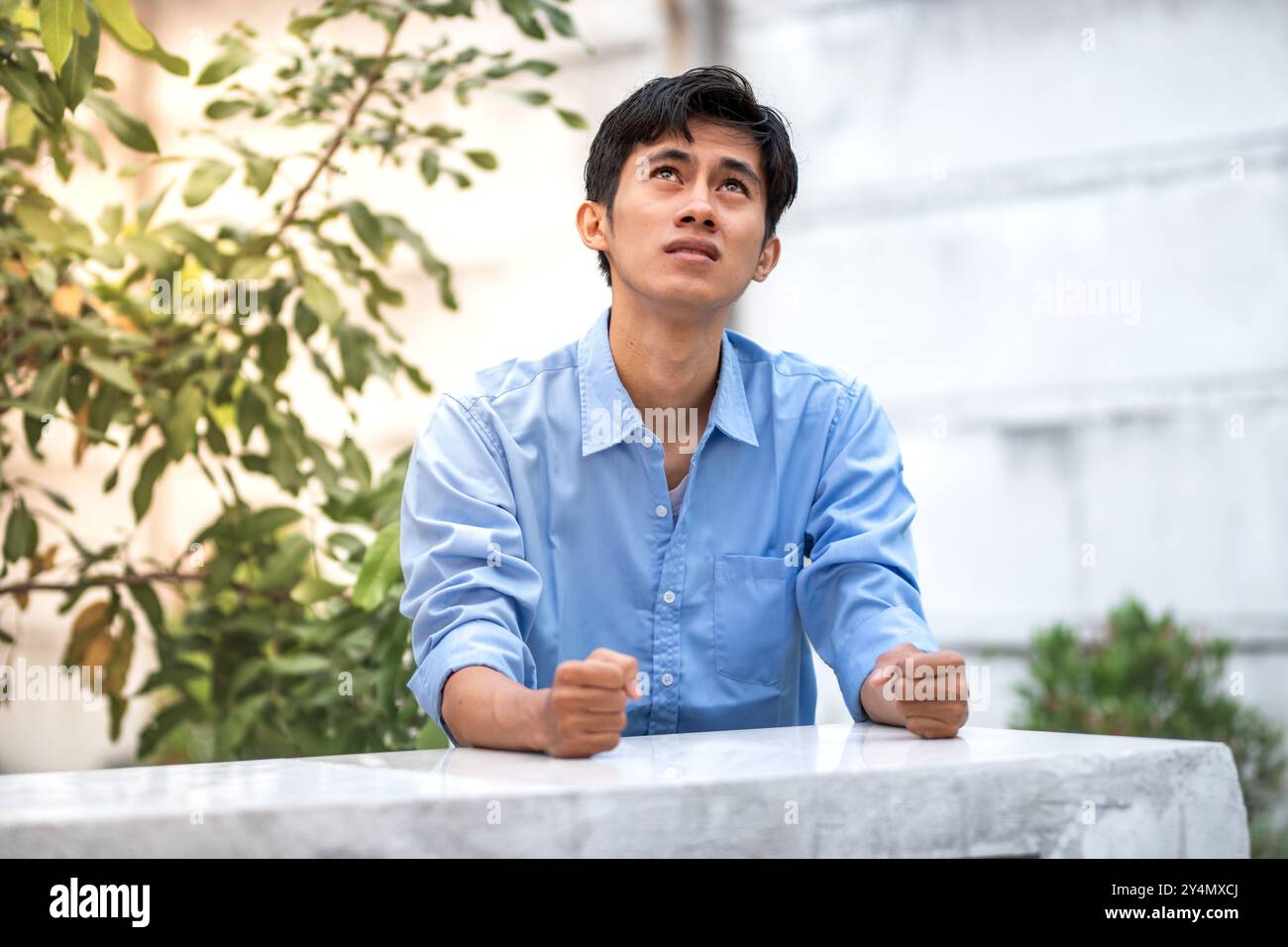 Young men in depression sitting alone in the park. Depressed and ...