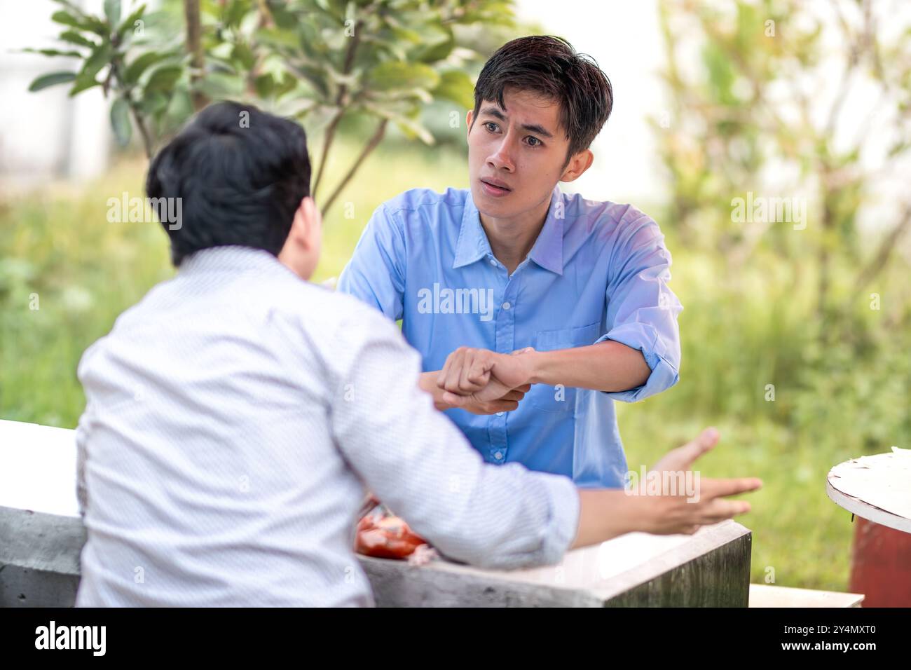 A guy scolds and blames someone for being late. Men getting scolded for ...