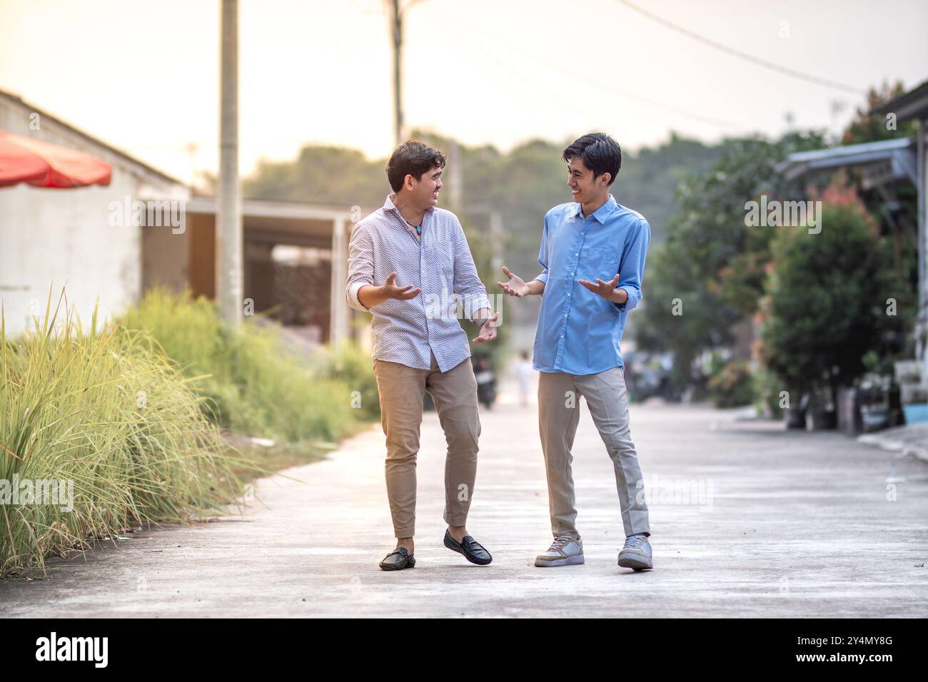 Young businessman discussing for their business. Happy young executive ...