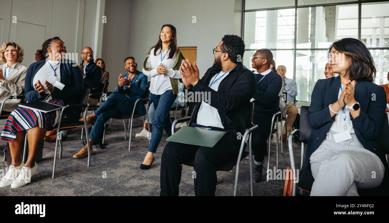 Professional speaker entering the stage at a business conference as ...