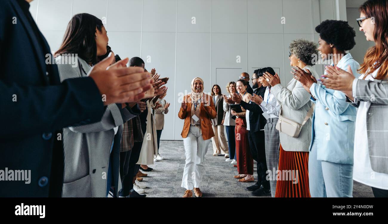 Diverse group of colleagues participating in a team building activity ...