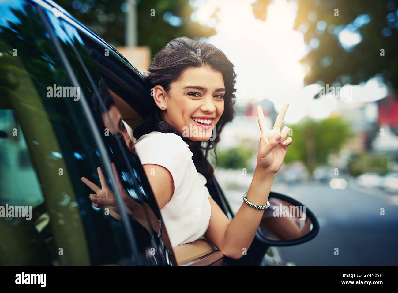 Portrait, smile and woman in car, peace sign and happy for road trip ...