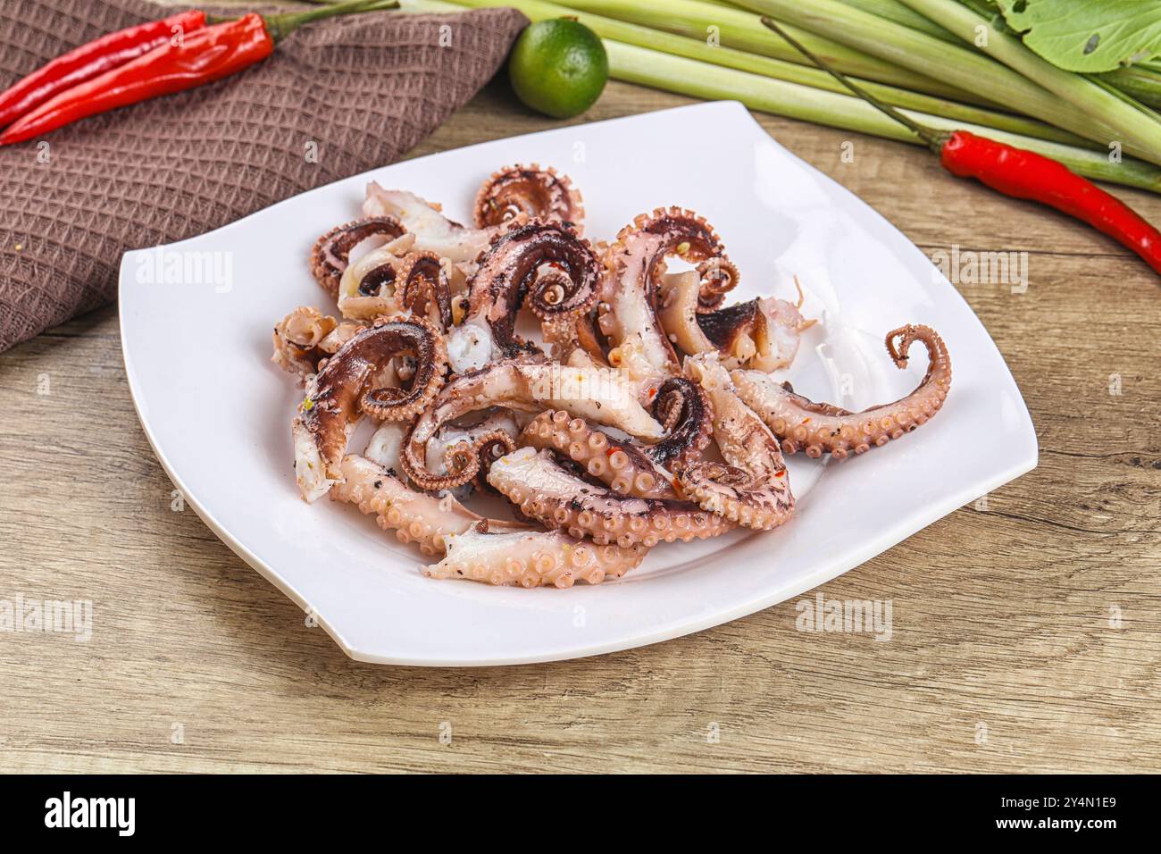 Grilled octopus red tentacle sliced appetizer Stock Photo - Alamy
