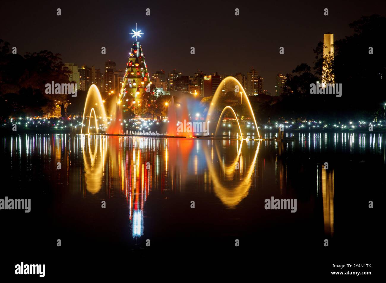 The colorful dancing fountain in red and yellow, the Christmas tree and ...