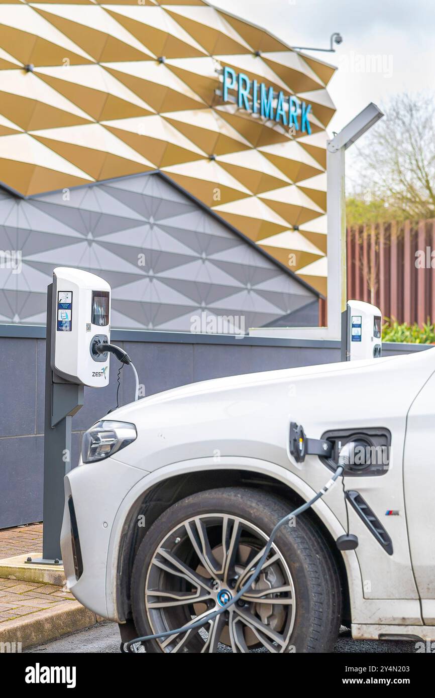 Outdoor view of electric car charging point being used outside Primark ...