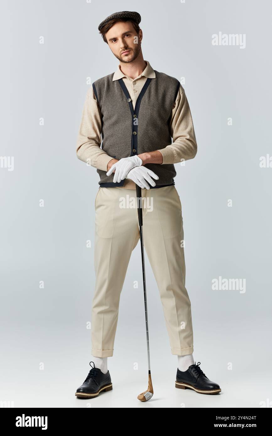 A handsome man stands poised, dressed sharply in a dandy outfit, ready ...