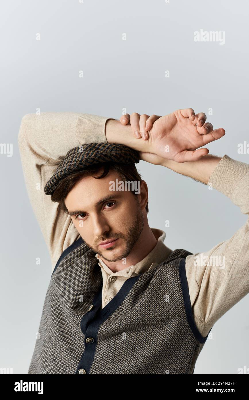 A refined young man dressed in classic attire strikes a confident pose ...