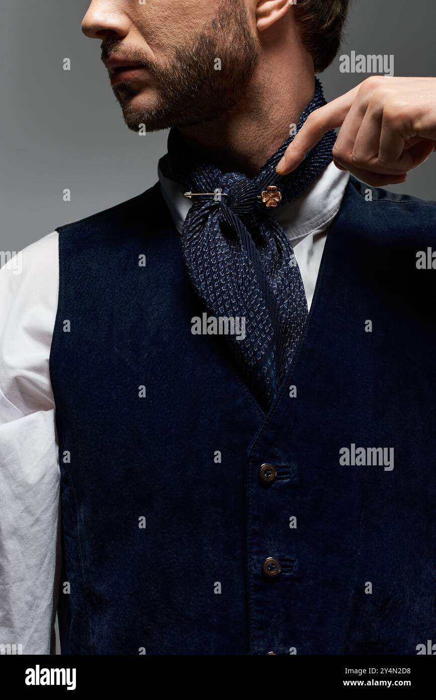 A dandy elegantly styles his outfit while preparing for a classy ...